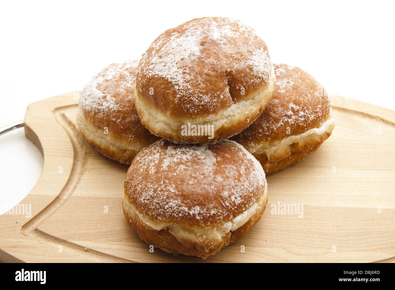 Donuts on wooden plate Stock Photo - Alamy