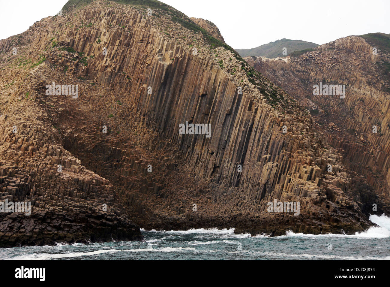 It's a photo of cliffs or cliff near the sea or ocean. We can see a ...