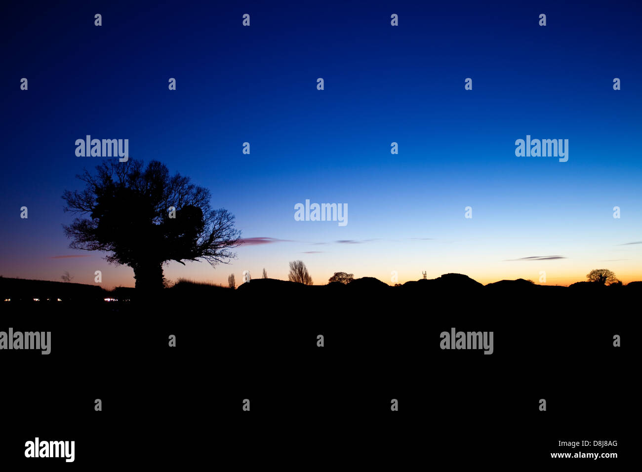Silhouette of a field at sunset Stock Photo - Alamy