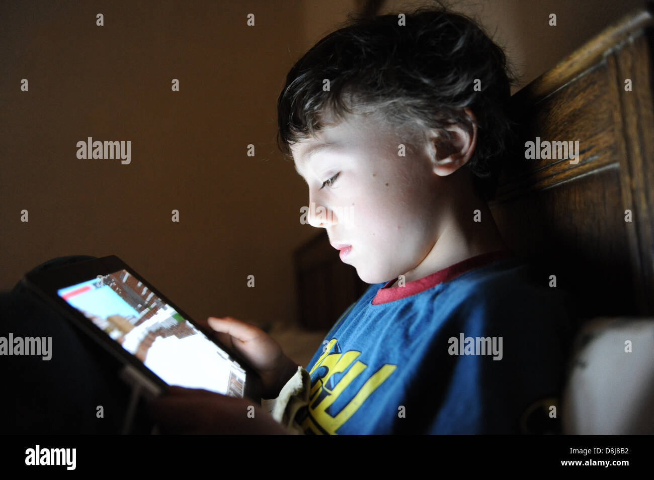 Boy Playing Games On Ipad