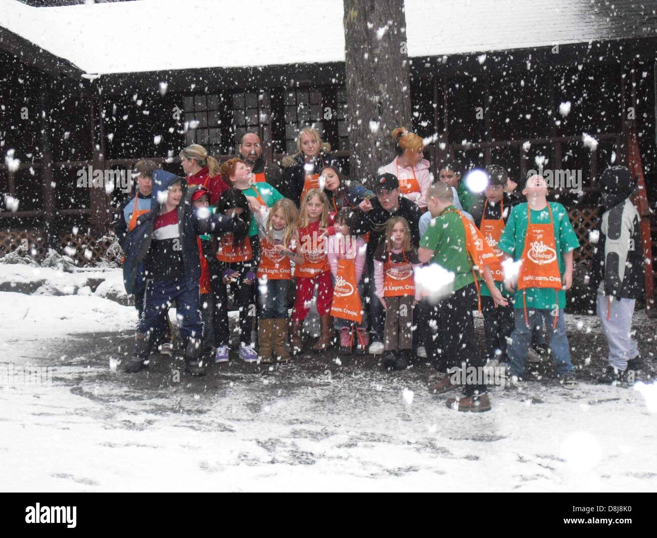 Group of children watching as snow falls Stock Photo - Alamy