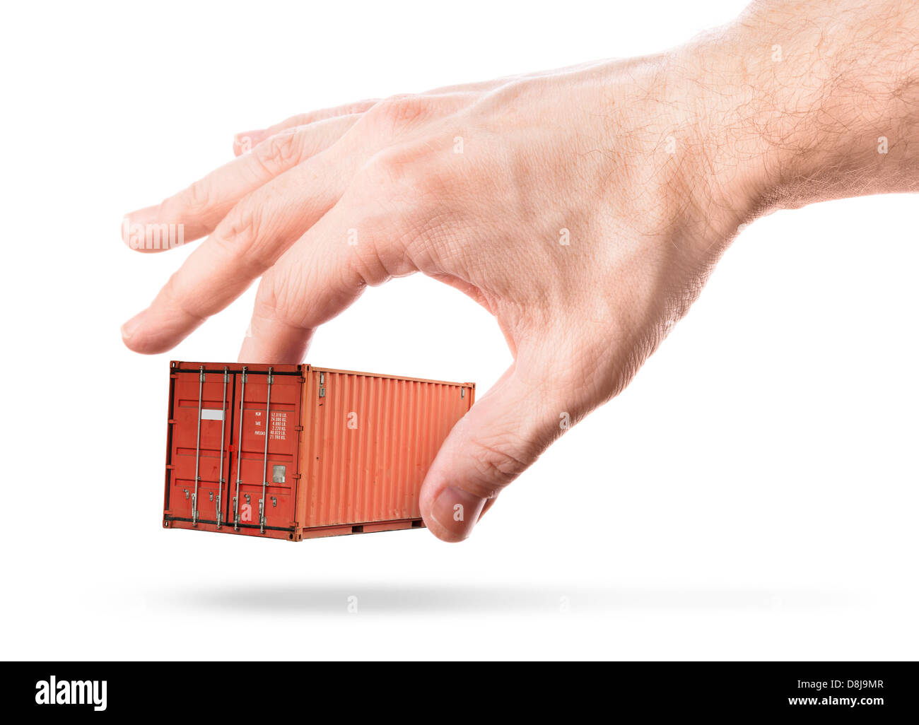 Bright red metal freight shipping container in man's hand isolated on ...