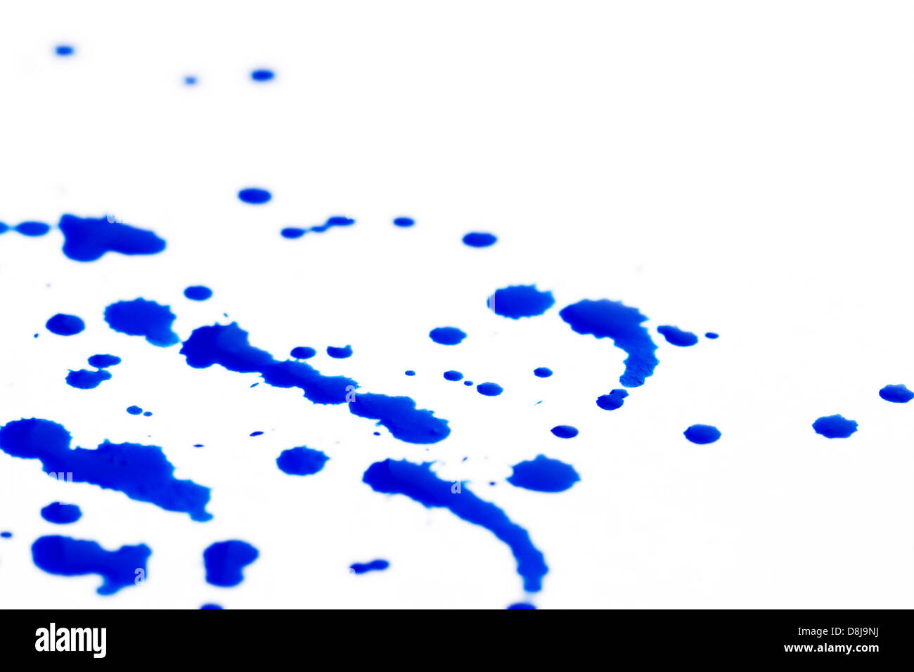 Blue splatter on white background Stock Photo - Alamy