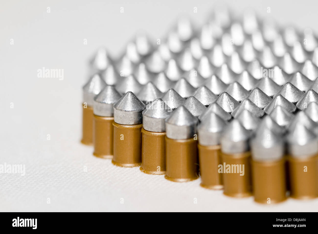 Gun bullets over white background Stock Photo - Alamy