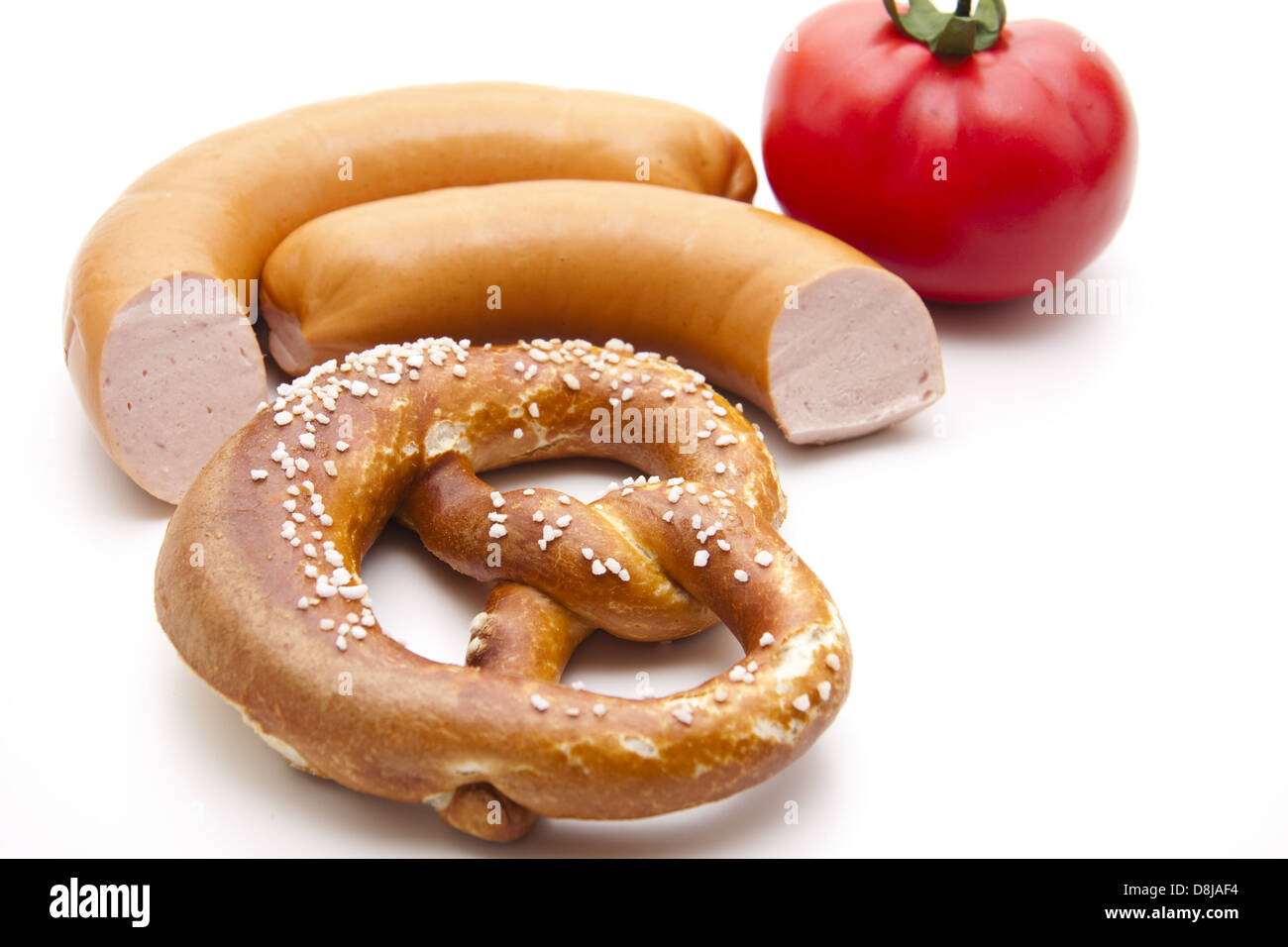 Pretzel with meat sausage Stock Photo - Alamy
