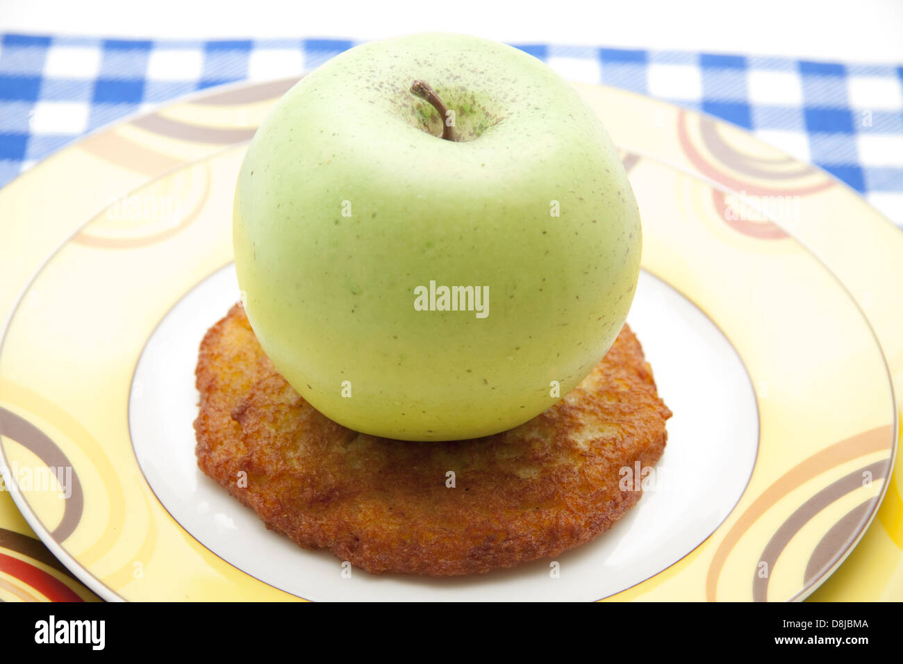 Apple on potato buffer Stock Photo - Alamy