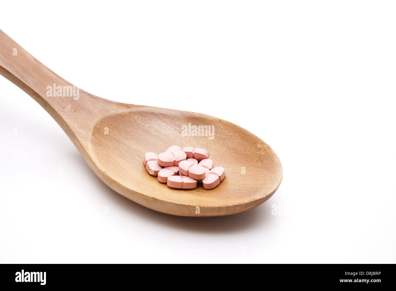Tablets on spoon Stock Photo - Alamy