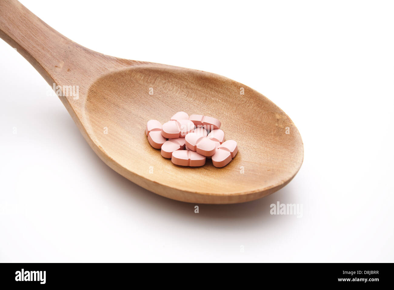 Tablets on spoon Stock Photo - Alamy