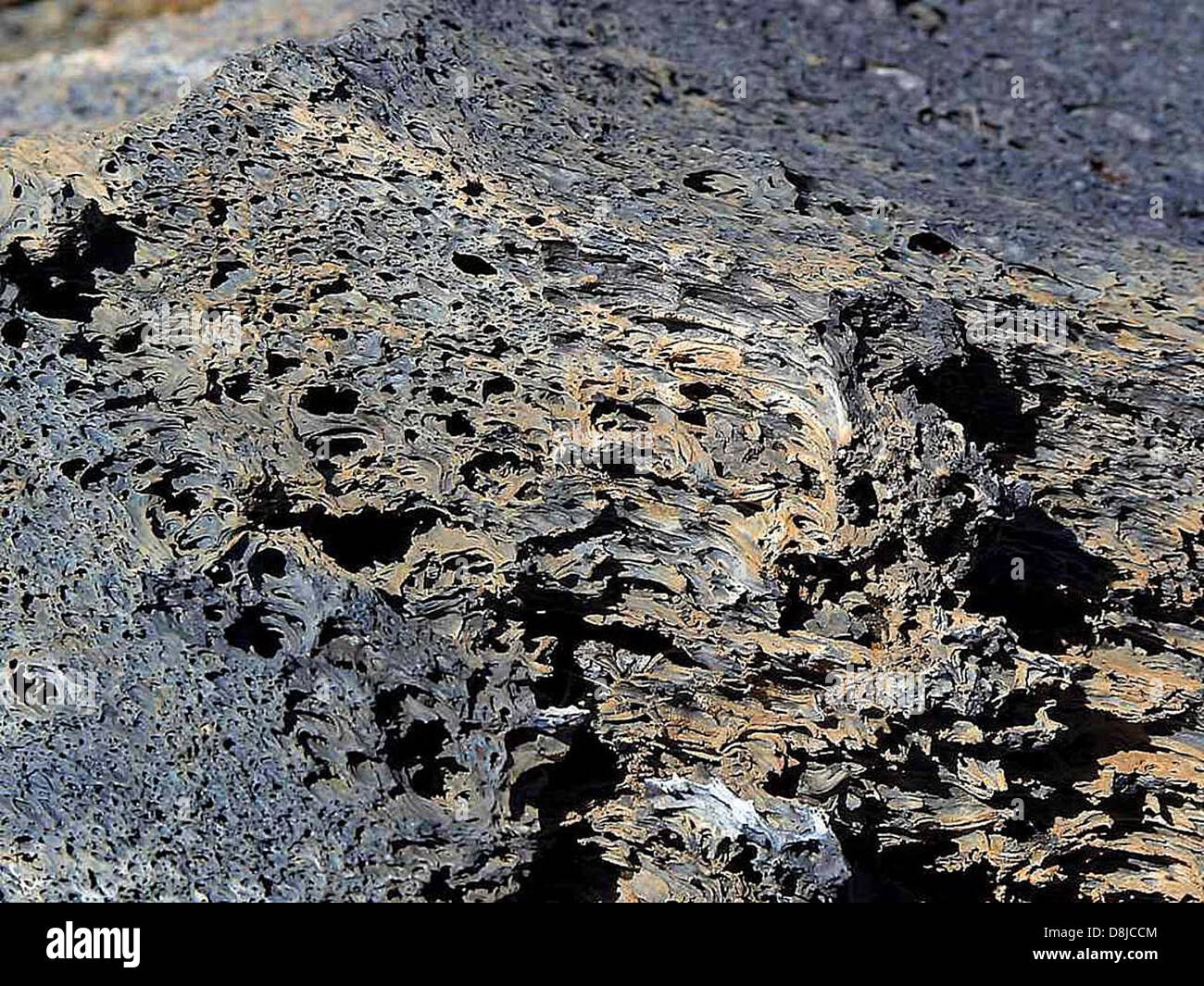 A volcanic landscape featuring lava craters, formed from past eruptions ...