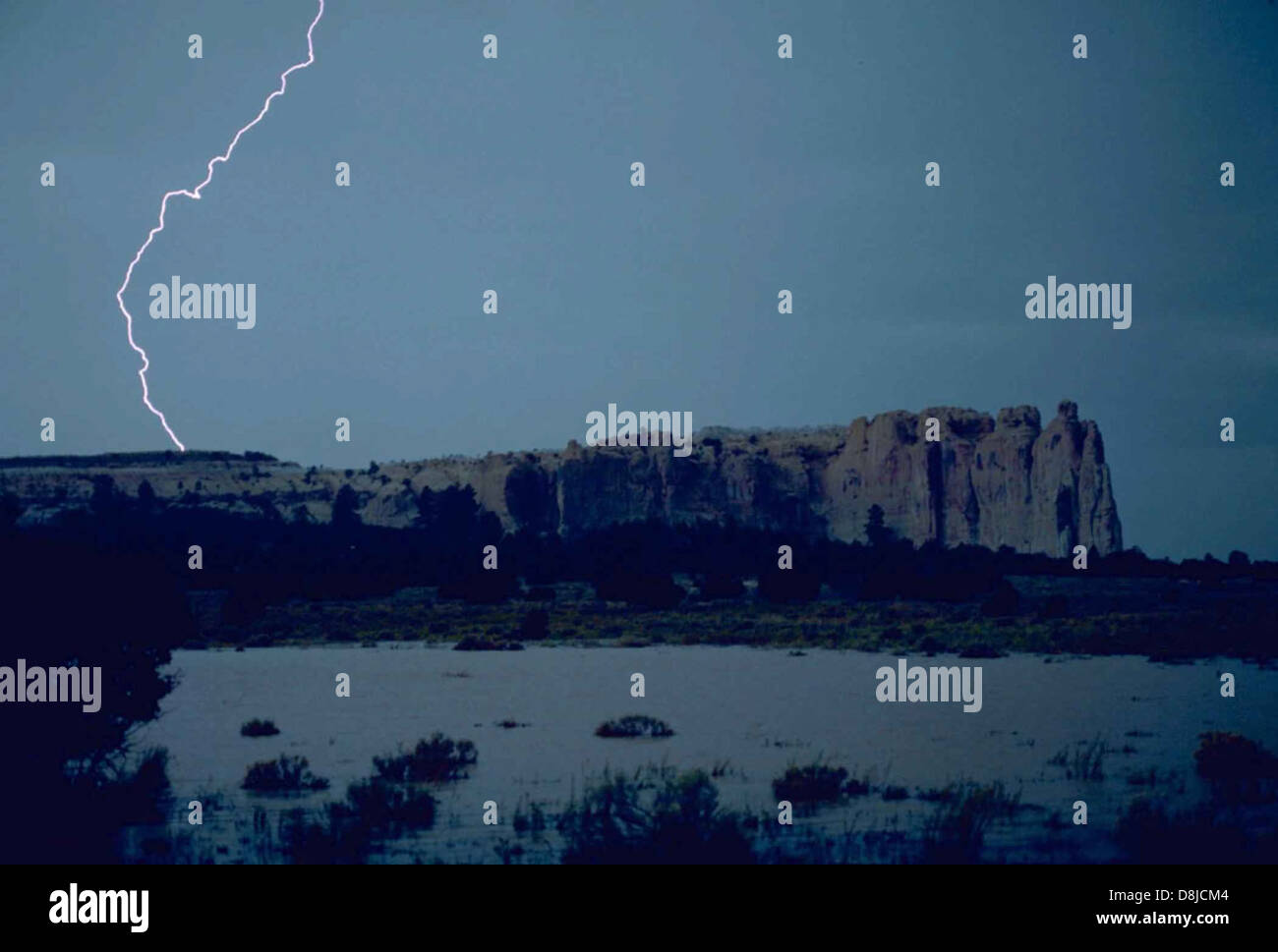 The lighting at El Morro National Monument creates dramatic effects as ...