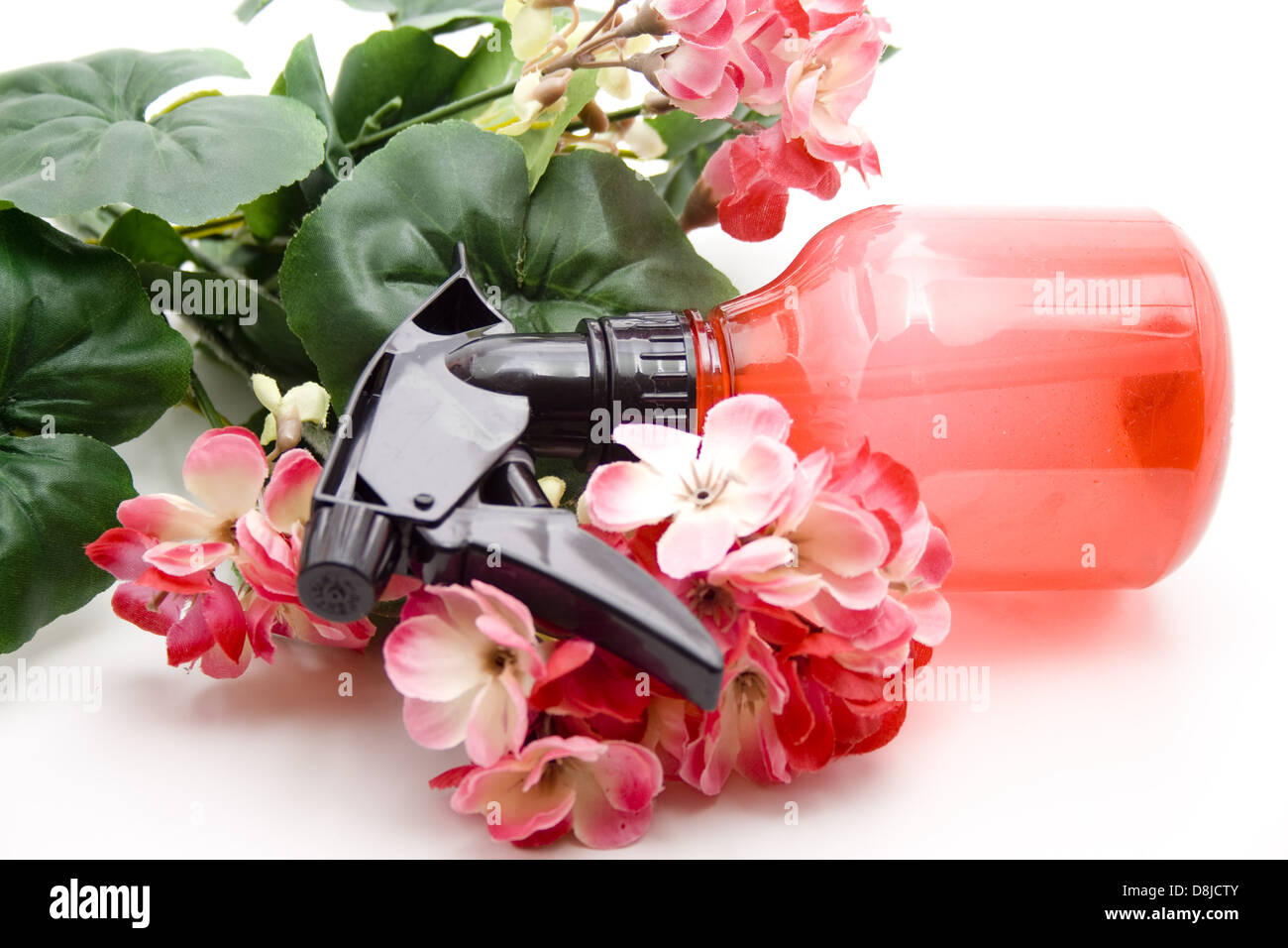 Spray bottle with flowers Stock Photo - Alamy