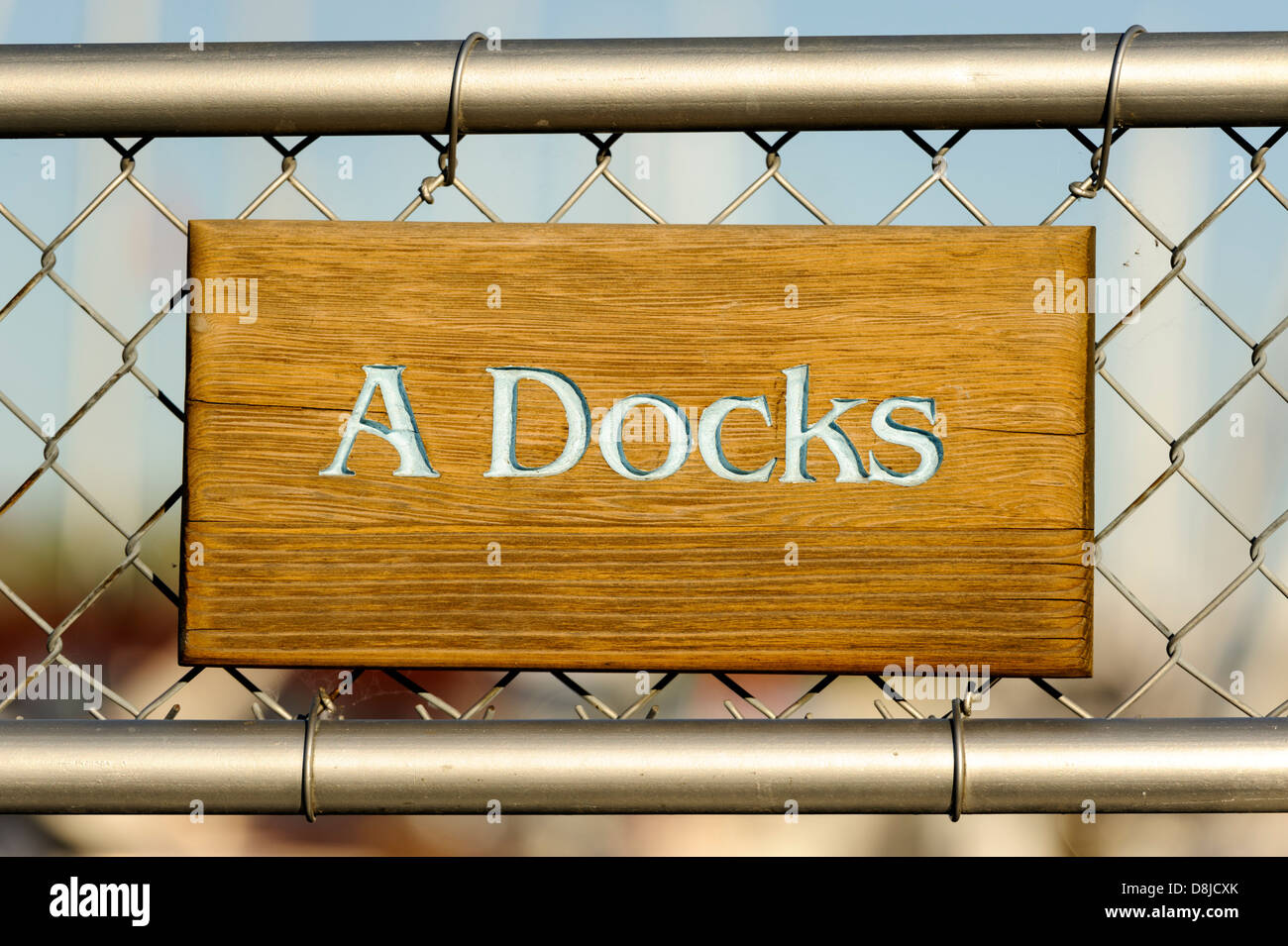 Boats marina docks sign on metal fence door Stock Photo - Alamy