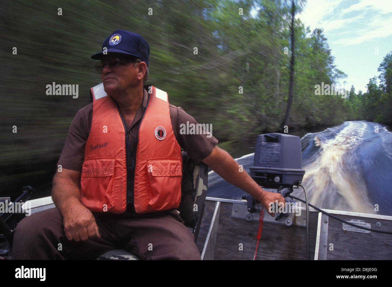 Man drives a motor boat Stock Photo - Alamy