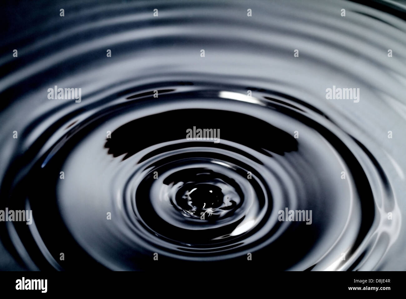 Dark Water Drop Splashing with Waves Stock Photo - Alamy