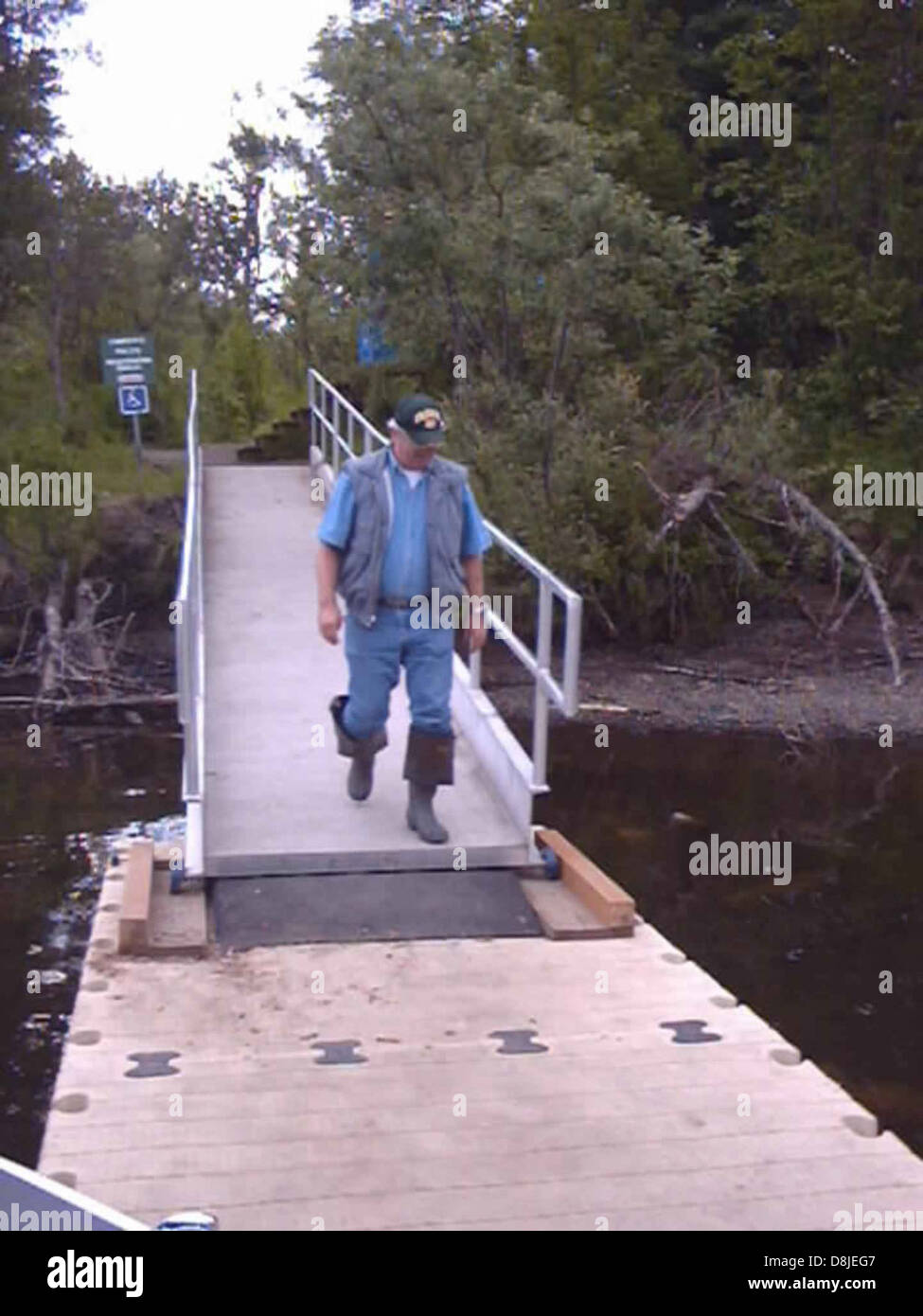 Man on dock pier Stock Photo - Alamy