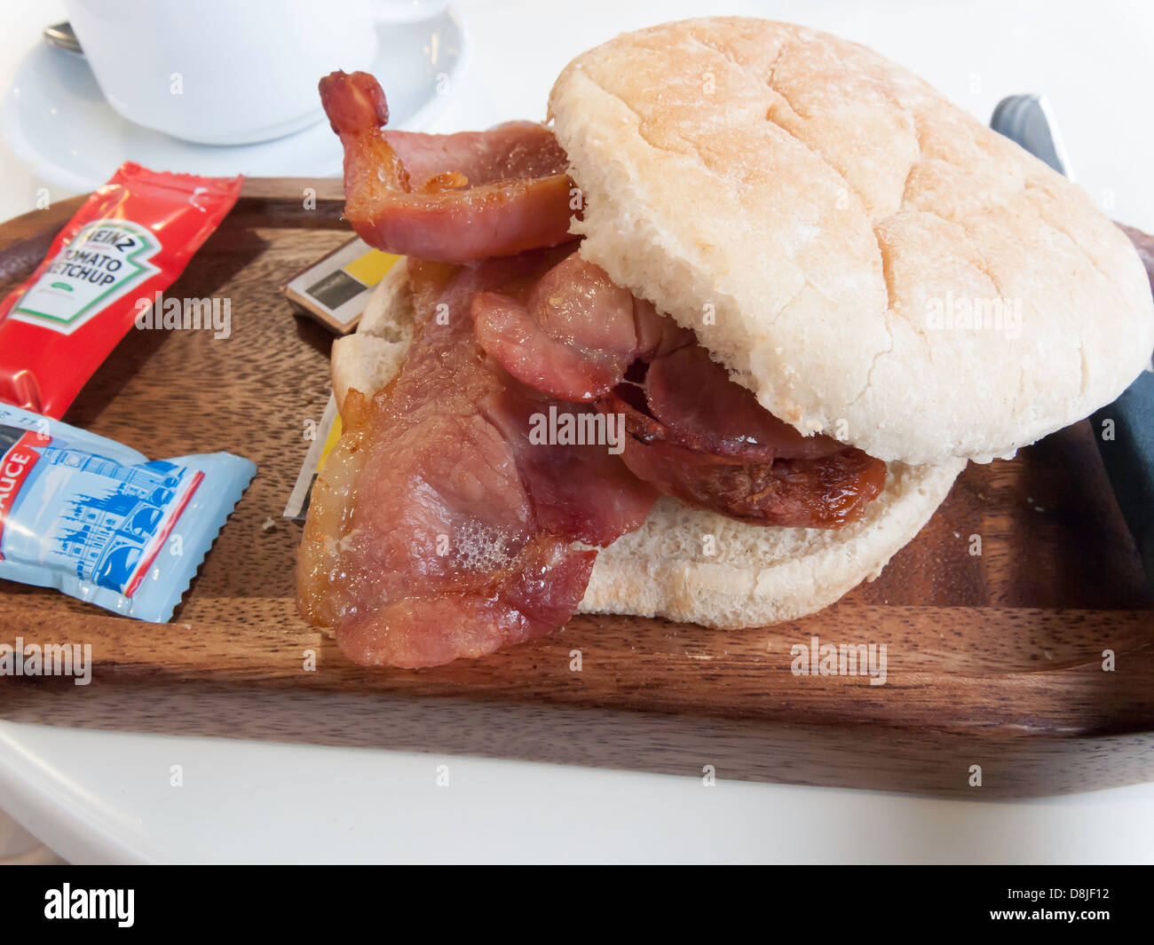 Lunchtime snack a bacon bun with sauces Stock Photo - Alamy