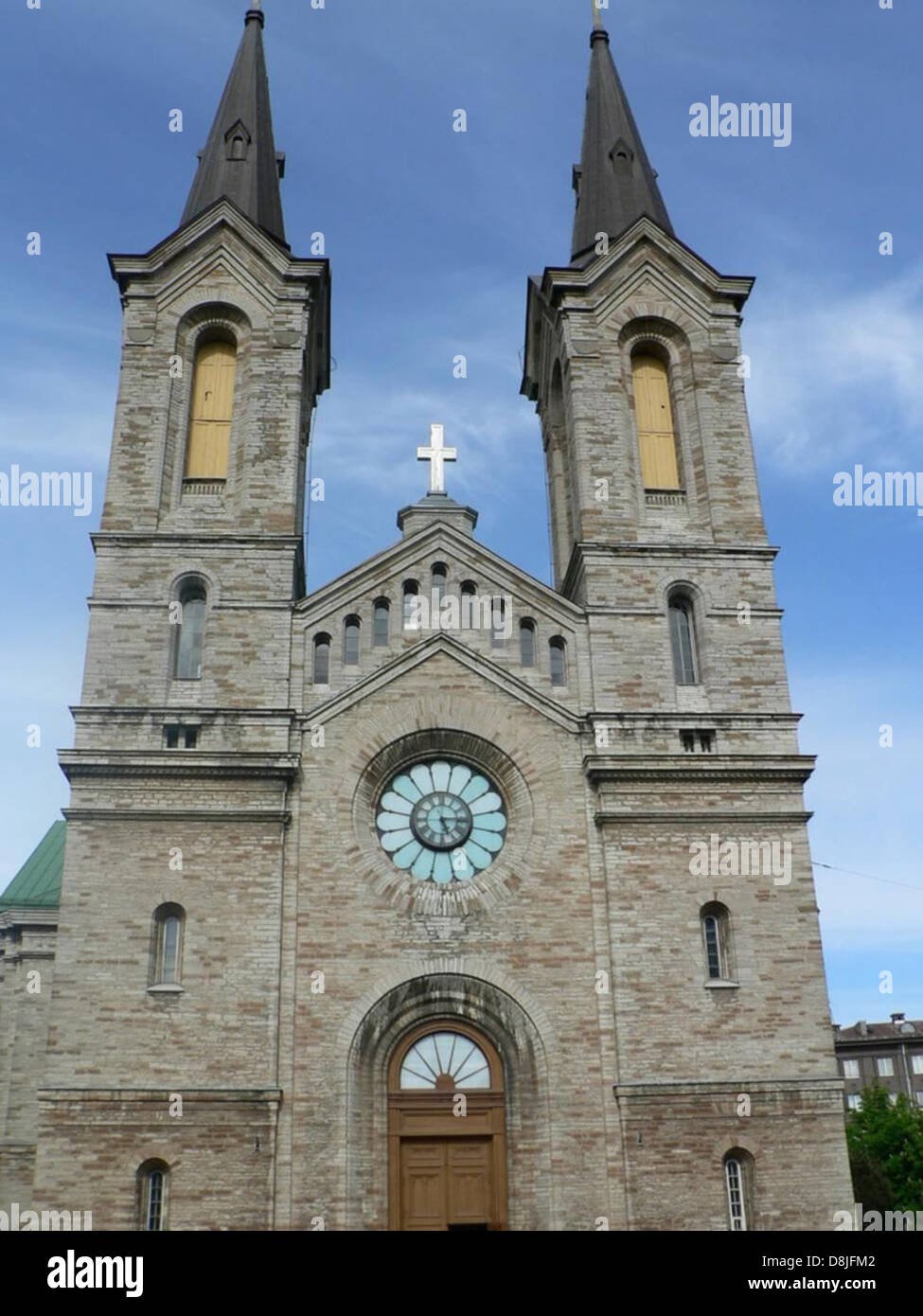 A medieval church, characterized by its stone walls, tall spires, and ...