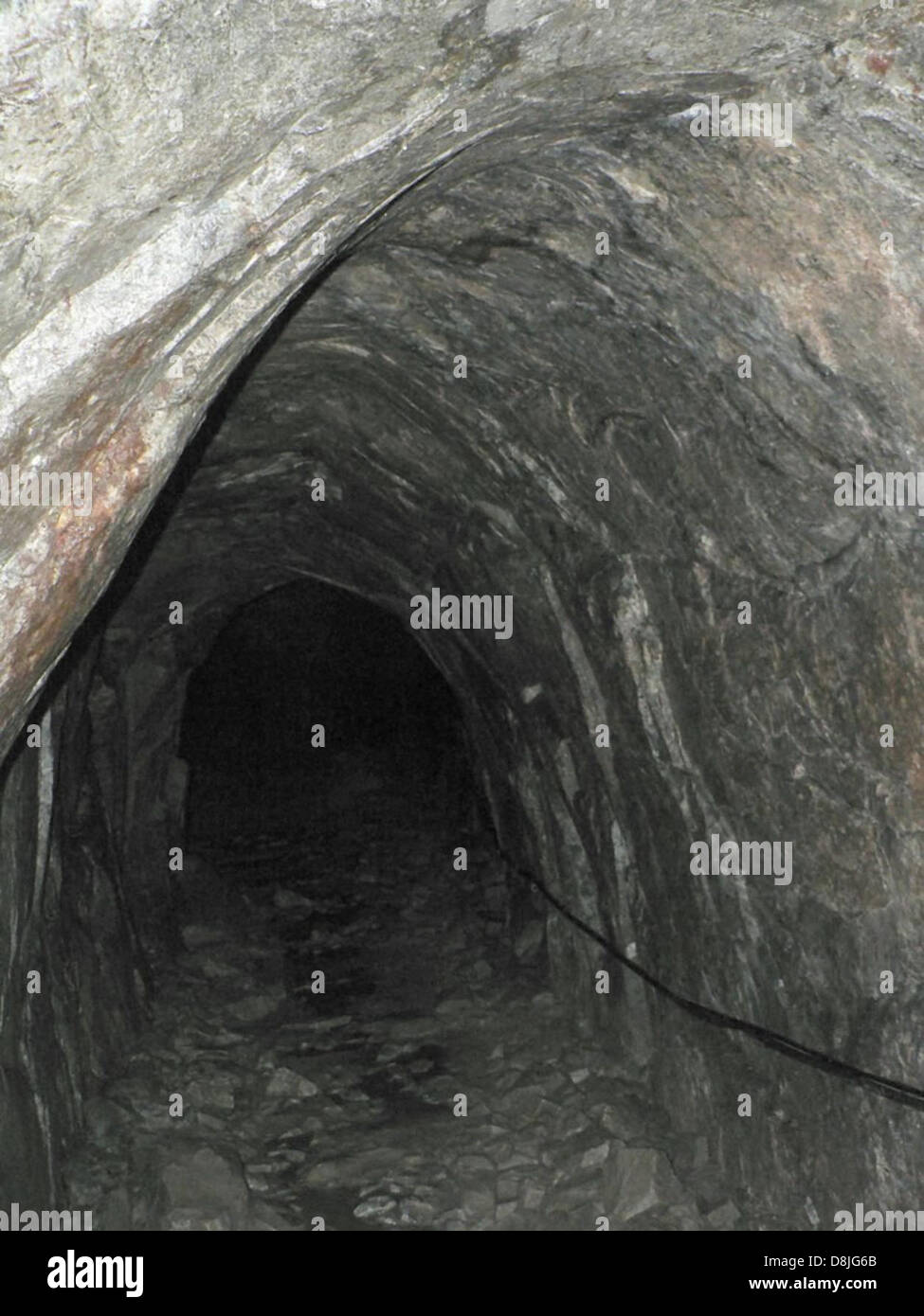 A mining path carved through rugged terrain, leading to a mining site ...