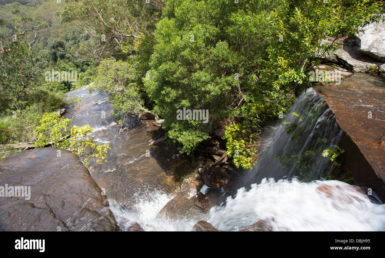 Water tumbling over rocks at Upper National Falls in the Royal National ...