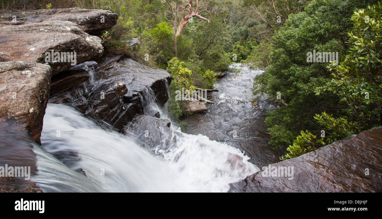 Water tumbling over rocks at Upper National Falls in the Royal National ...