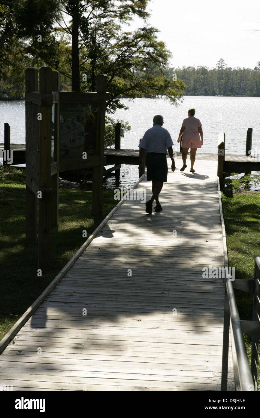 A person enjoys a walk on a pleasant day, taking in the fresh air and ...