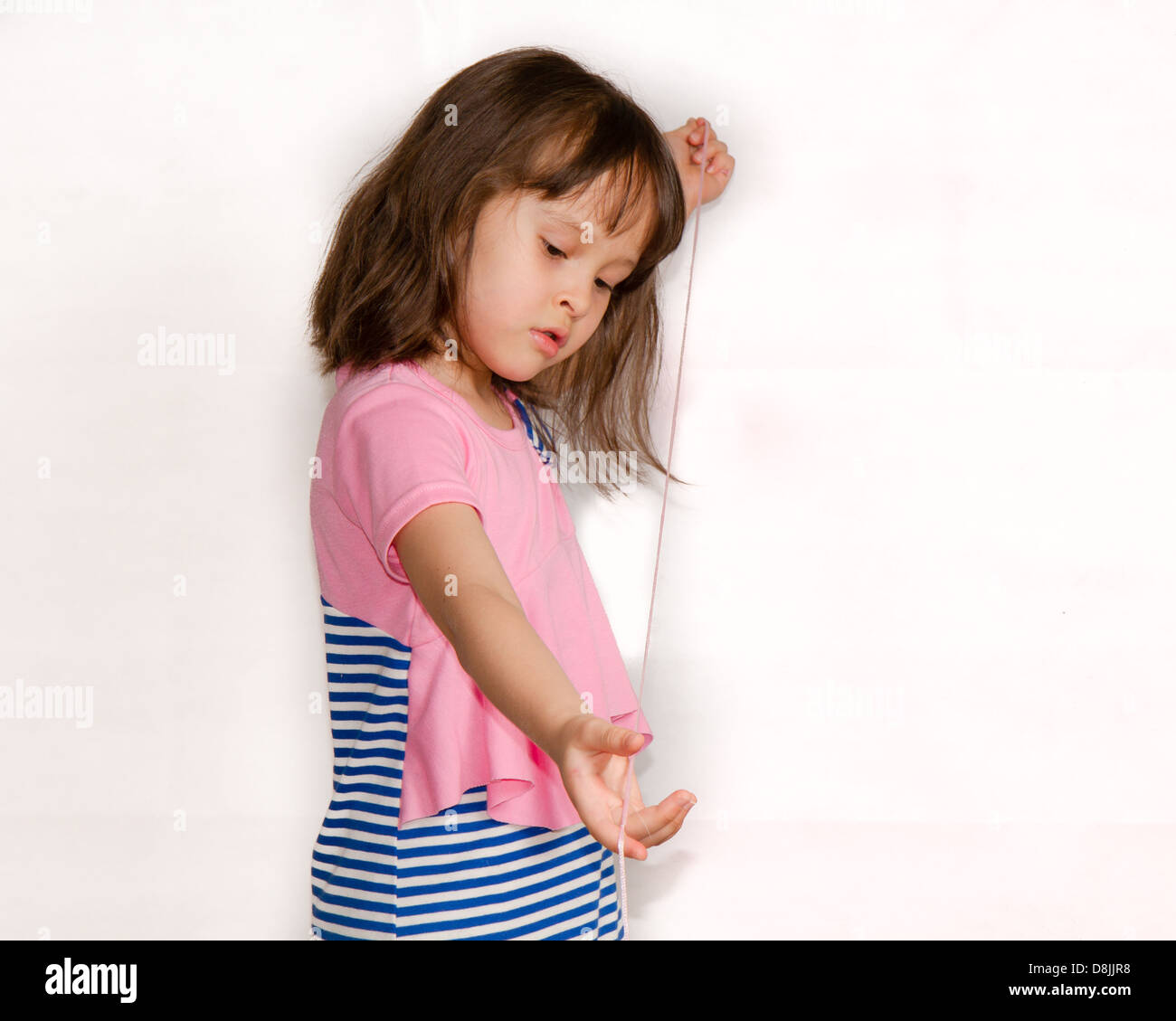 Asian child with remote control Stock Photo - Alamy