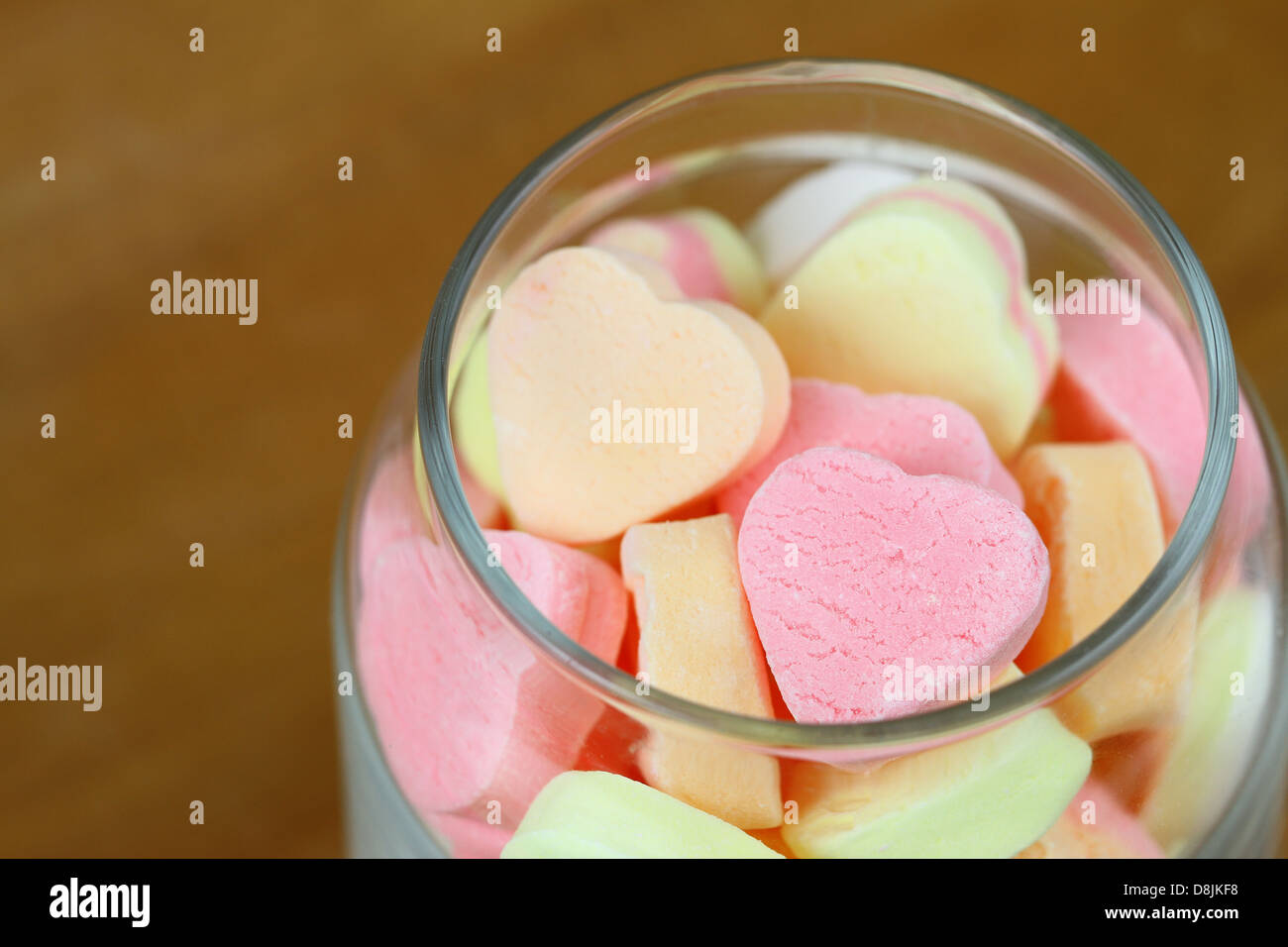 Colorful sugar hearts in glass jar, close up Stock Photo - Alamy