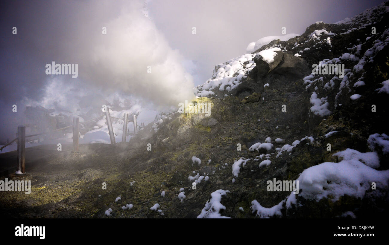 A smoking fumarole spewing hot volcanic gas at the active Tamagawa ...