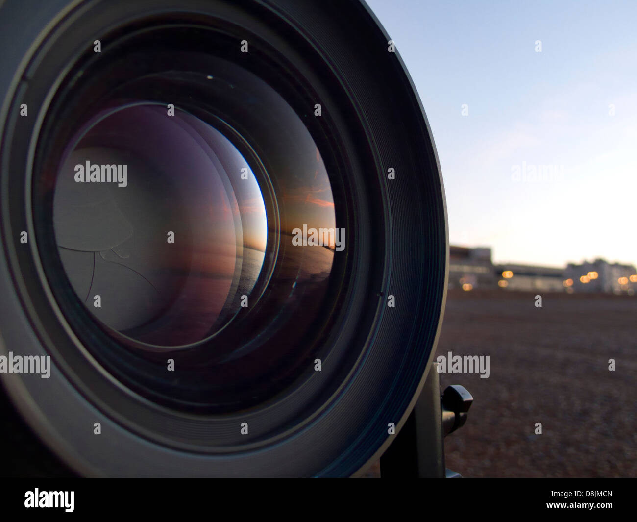 Camera lens, reflected sunrise, Brighton beach Stock Photo - Alamy
