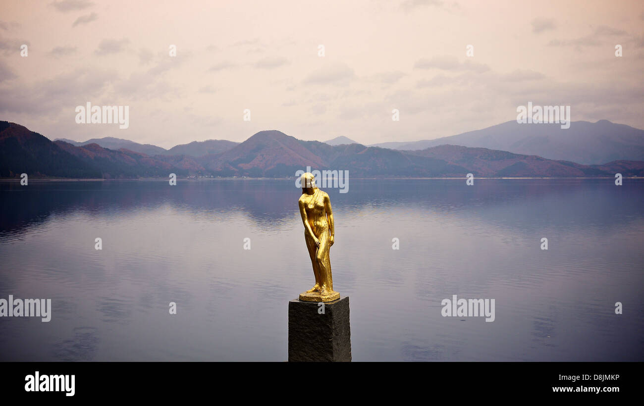 Statue of Tatsuko watching over Lake Tazawa in Autumn Stock Photo - Alamy