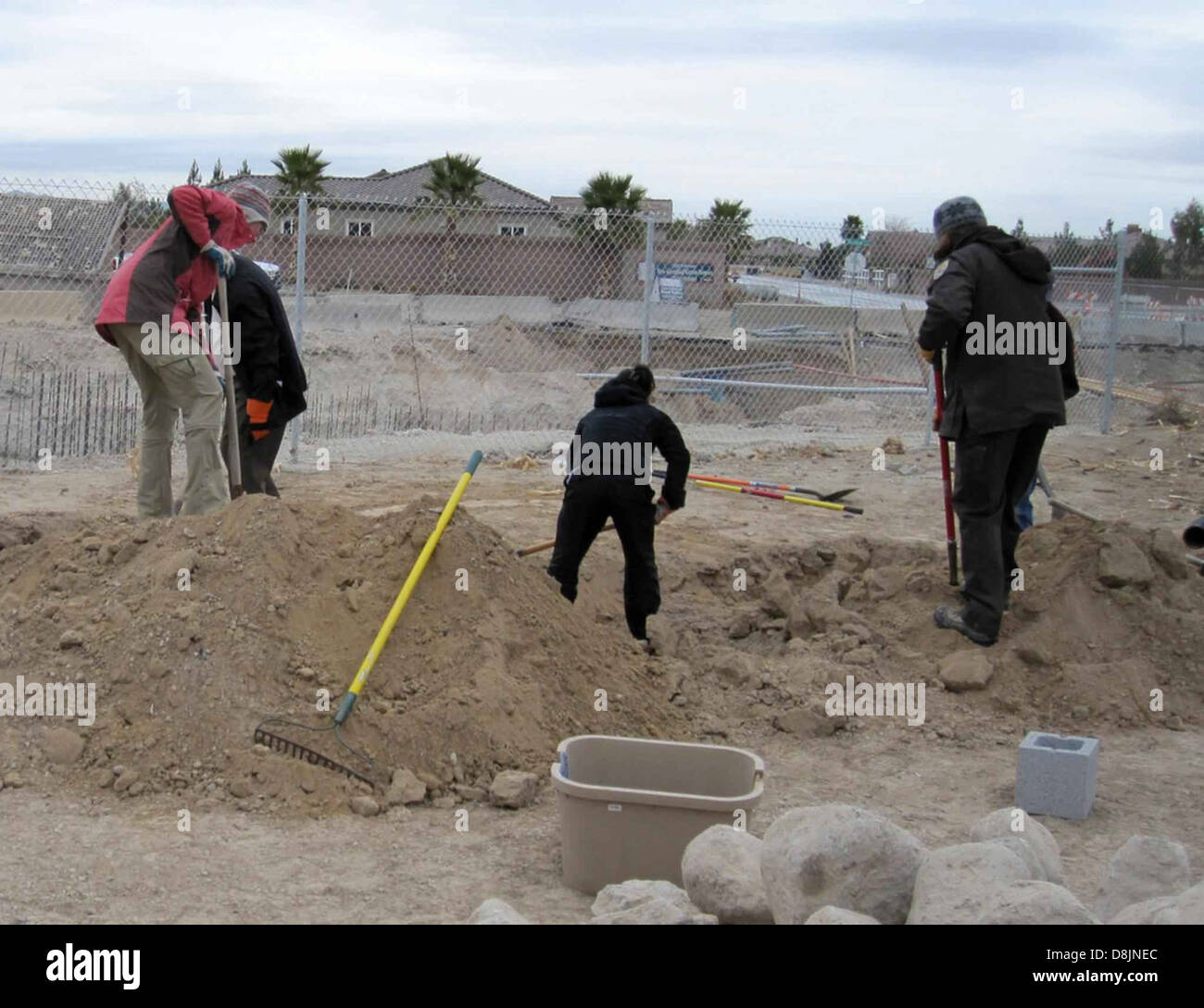 People are seen working in an urban environment, engaged in ...