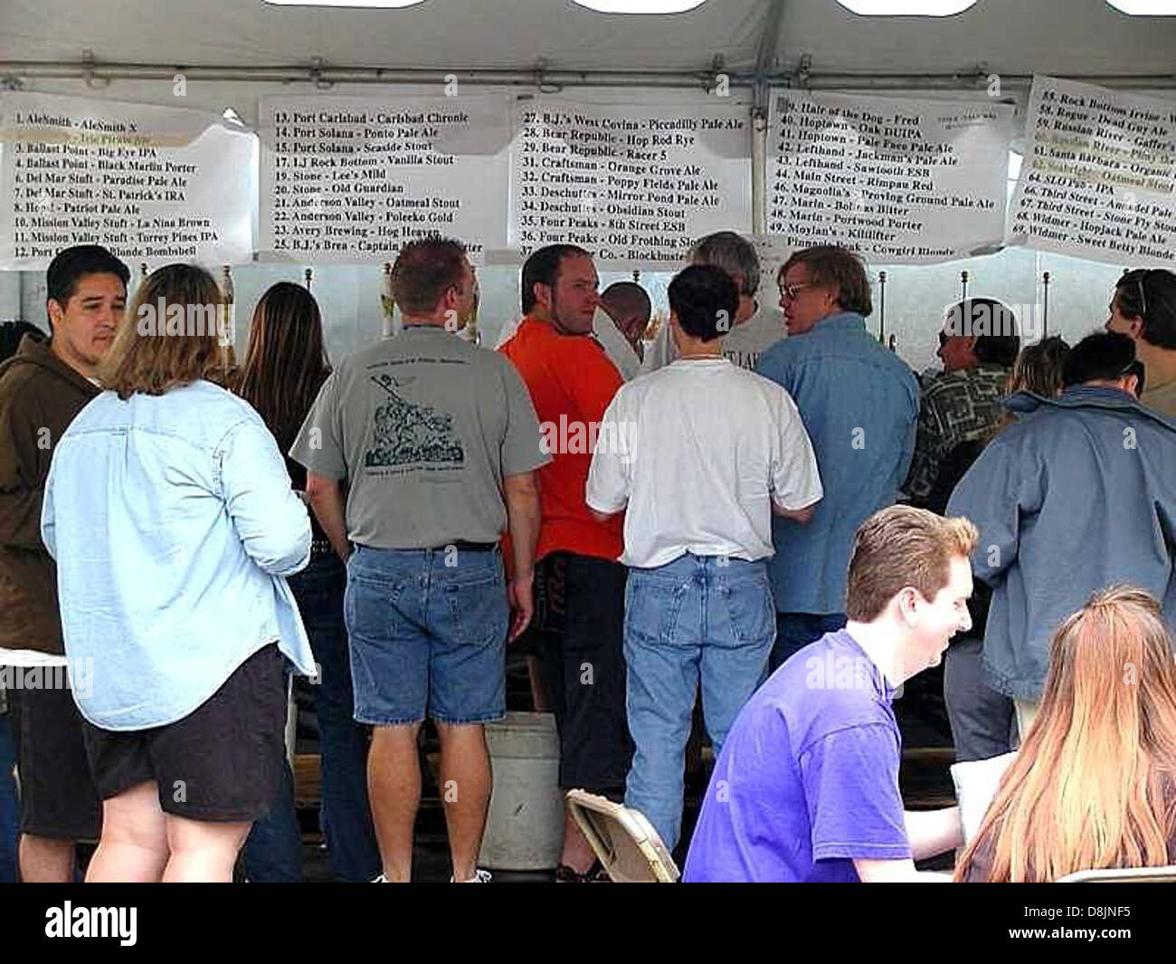 A crowd of people gathered in a public space. The image captures the ...