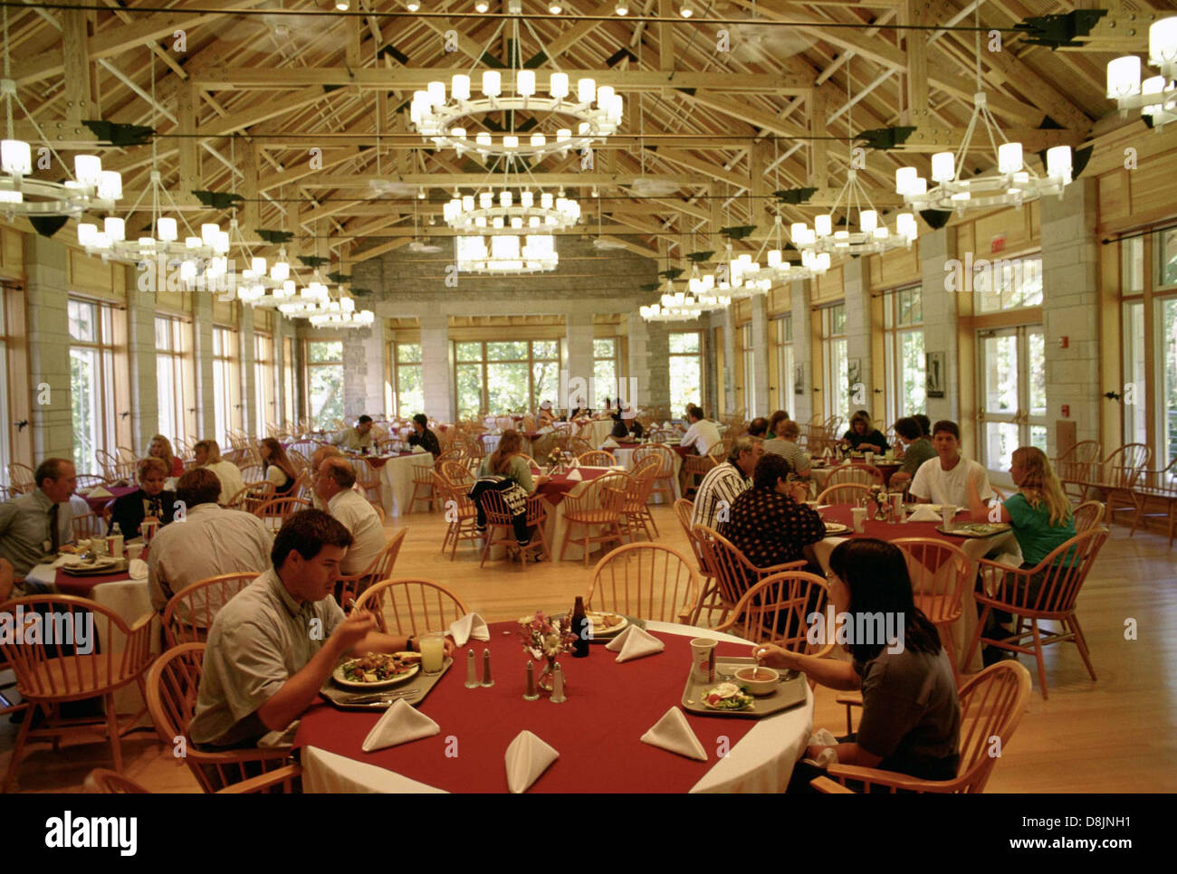 People enjoying a meal in the dining hall Stock Photo - Alamy