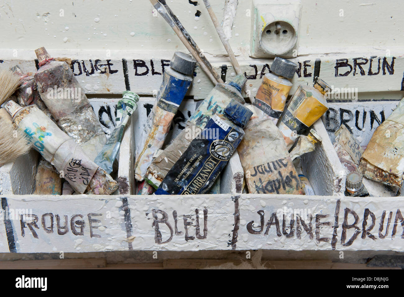 Paint tubes sorted by color in box Stock Photo - Alamy