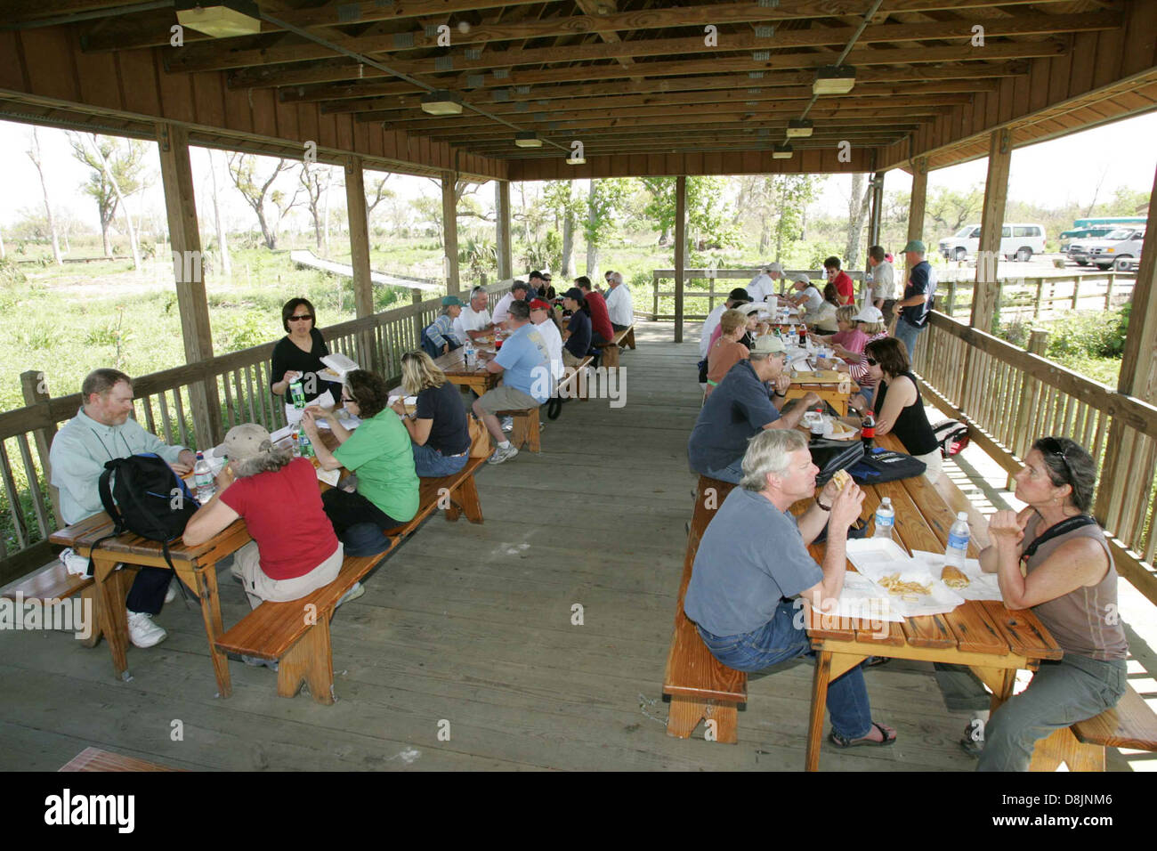 A group of people enjoys a meal together, sharing quality time with ...