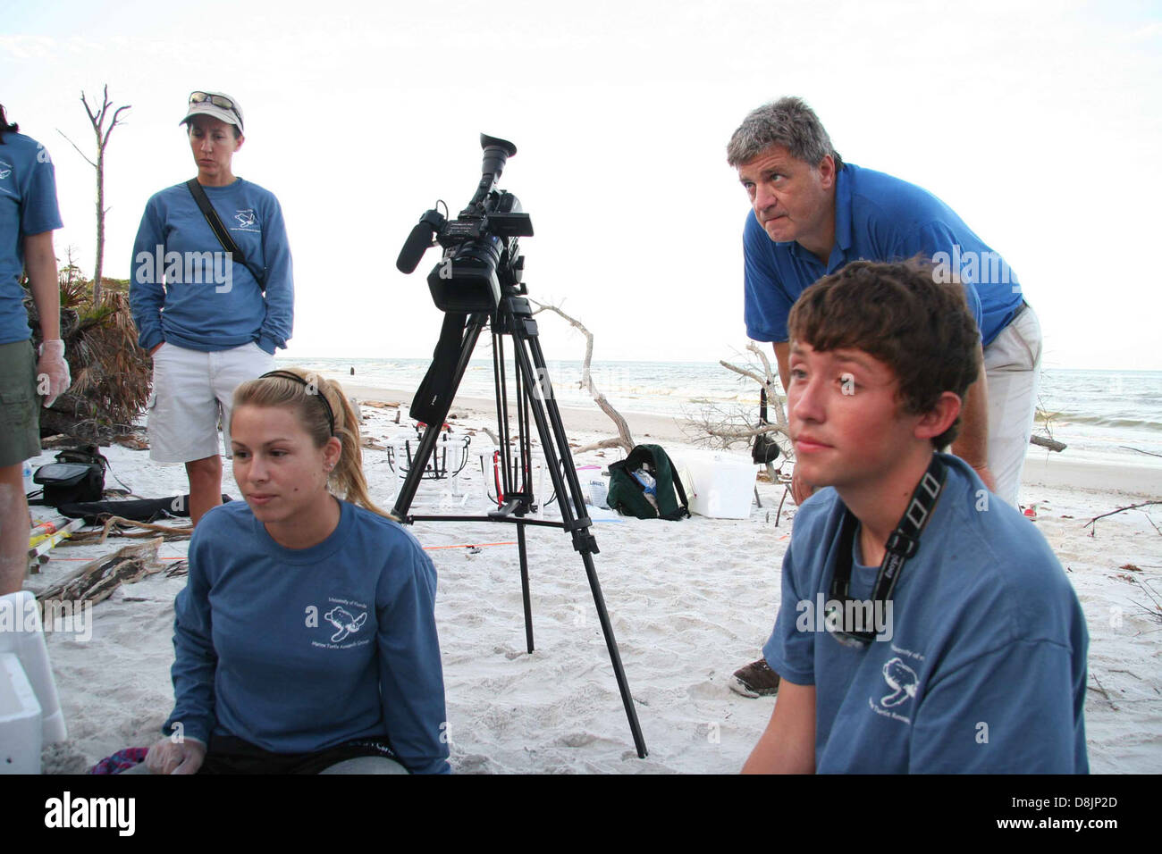 People on the beach talk and shoot camera Stock Photo - Alamy