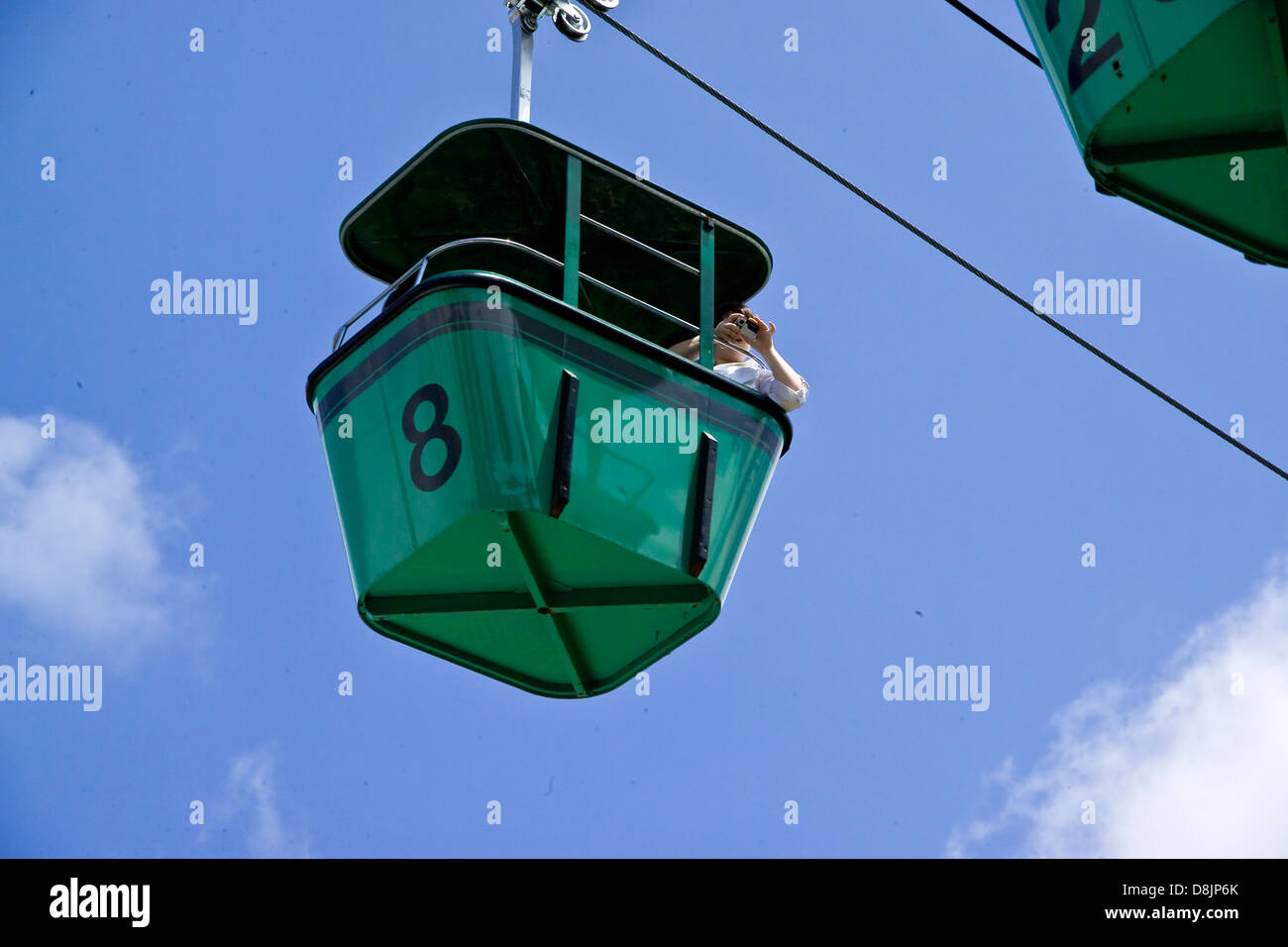 Cable car with passenger taking a picture Stock Photo - Alamy