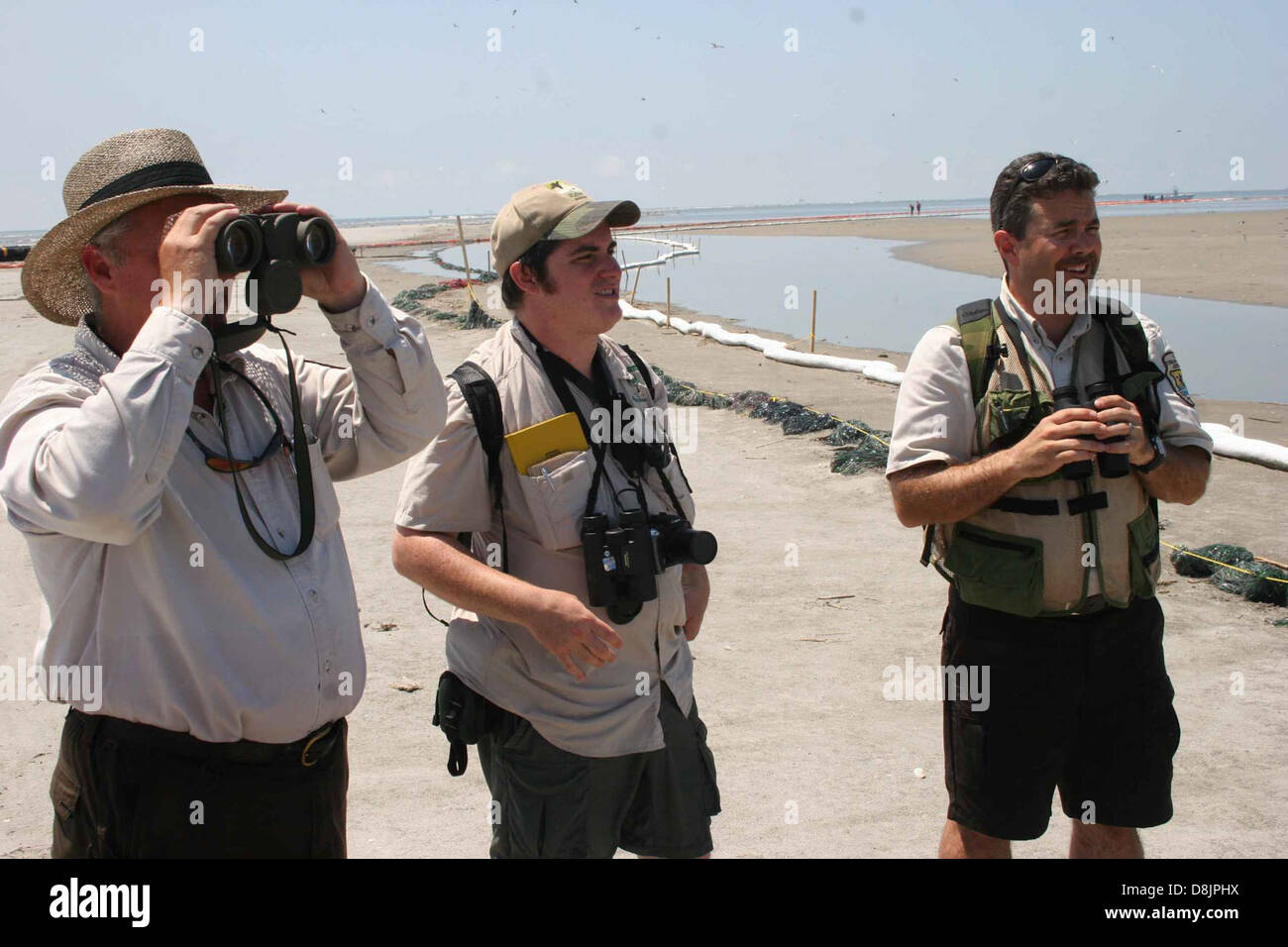 People watching on beach Stock Photo - Alamy