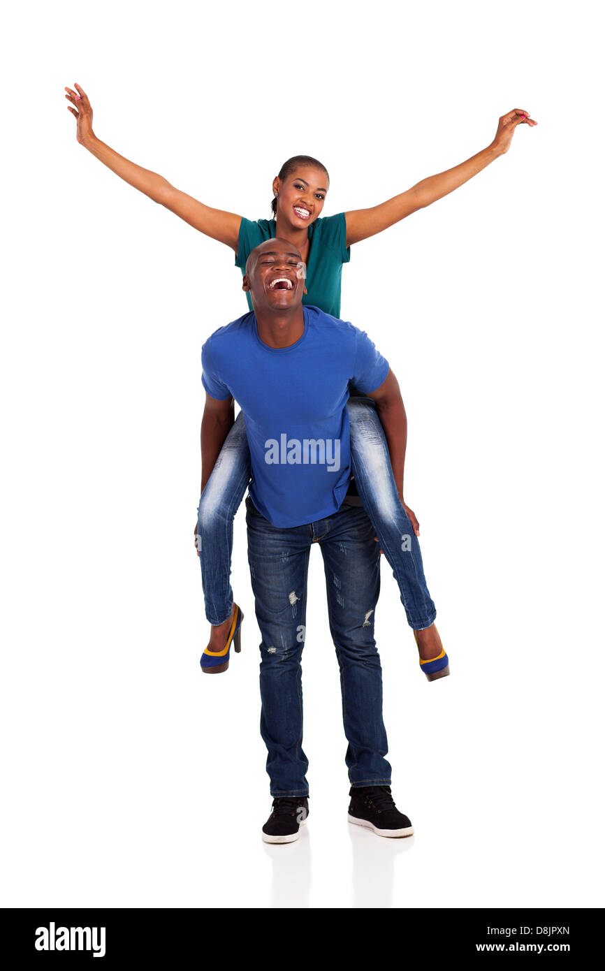 young african couple piggyback on white background Stock Photo - Alamy