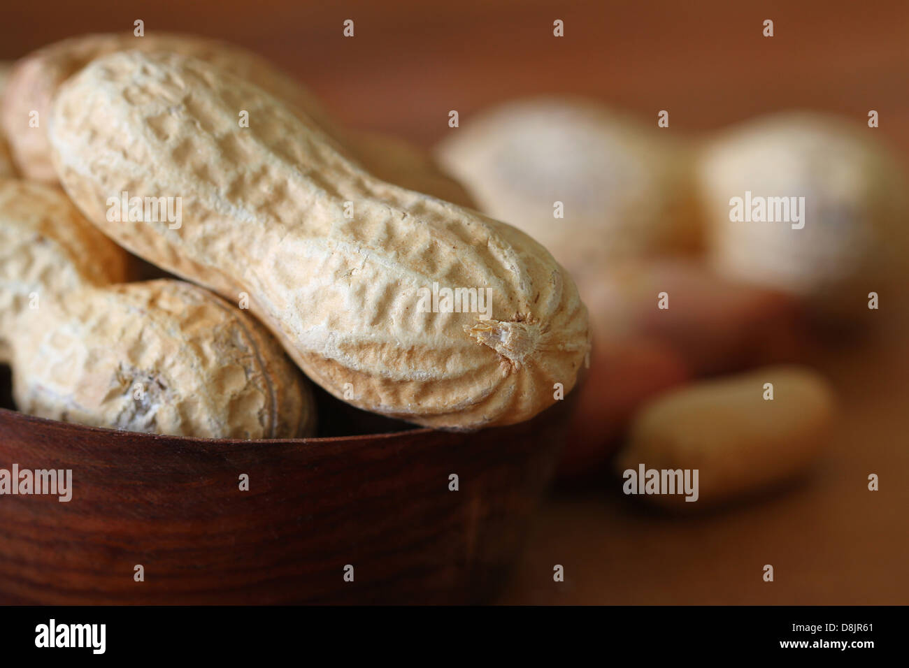 Peanuts with and without shell, close up Stock Photo - Alamy