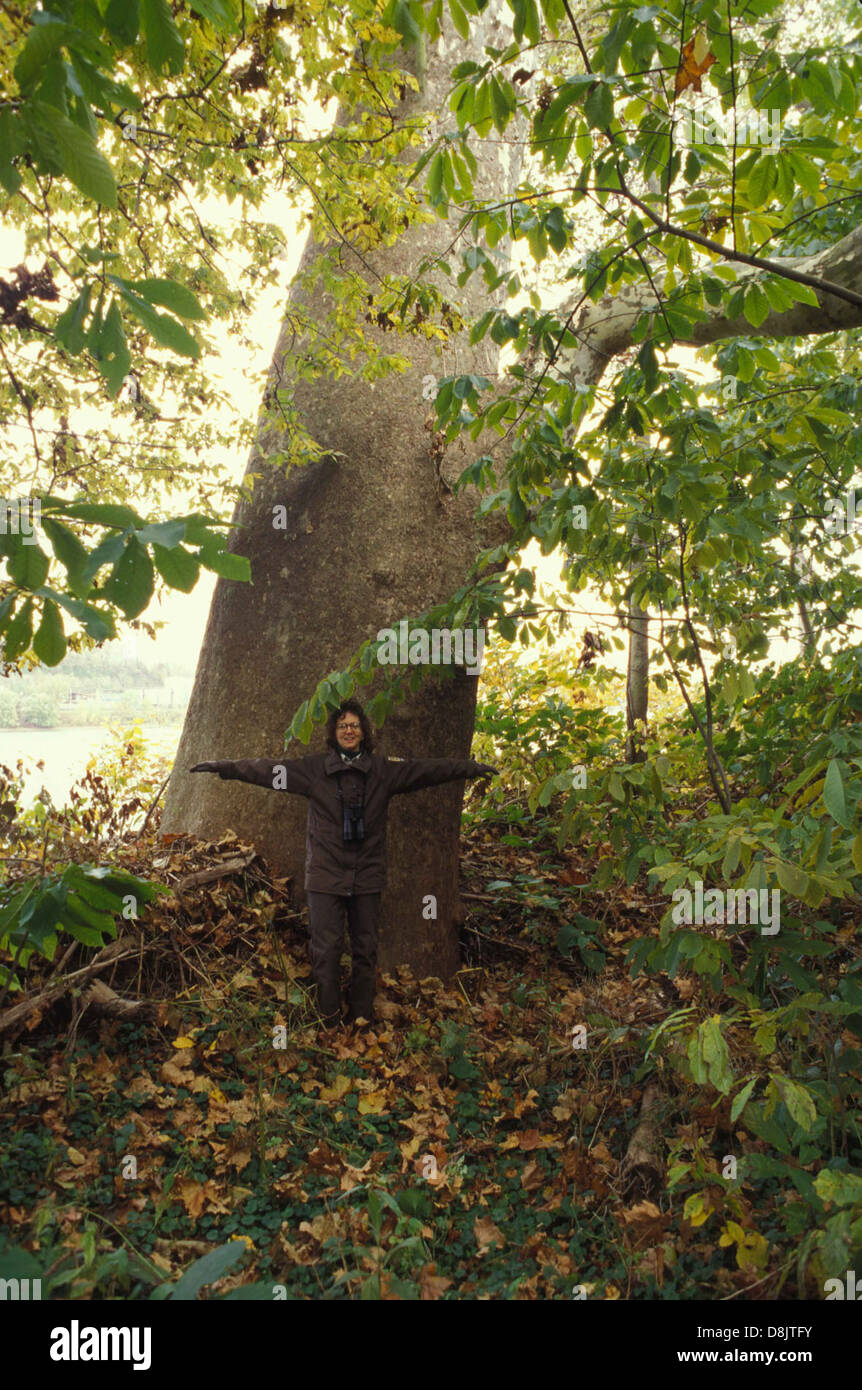 A person stretches their arms out to demonstrate the size of a large ...