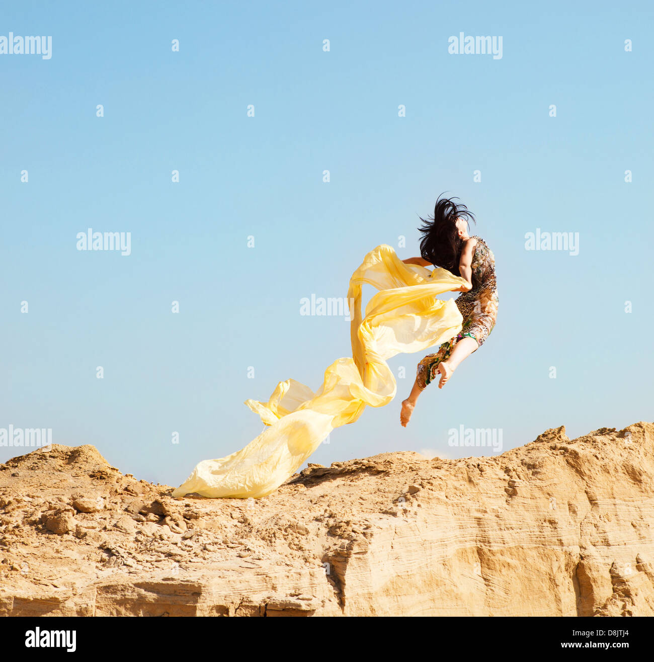 Beautiful young woman jumping Stock Photo - Alamy