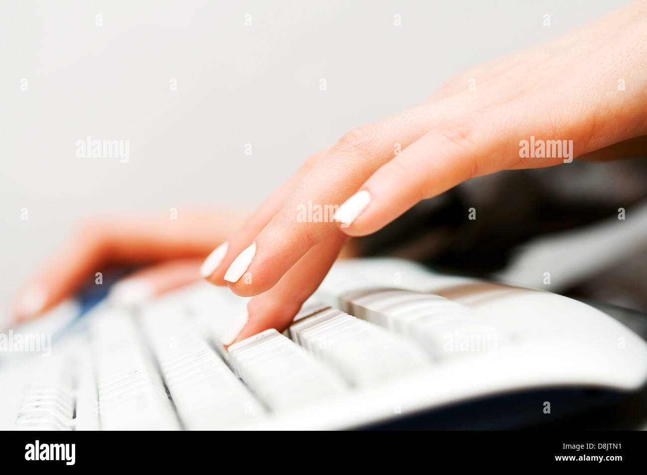 Female hands typing on computer keyboard Stock Photo - Alamy