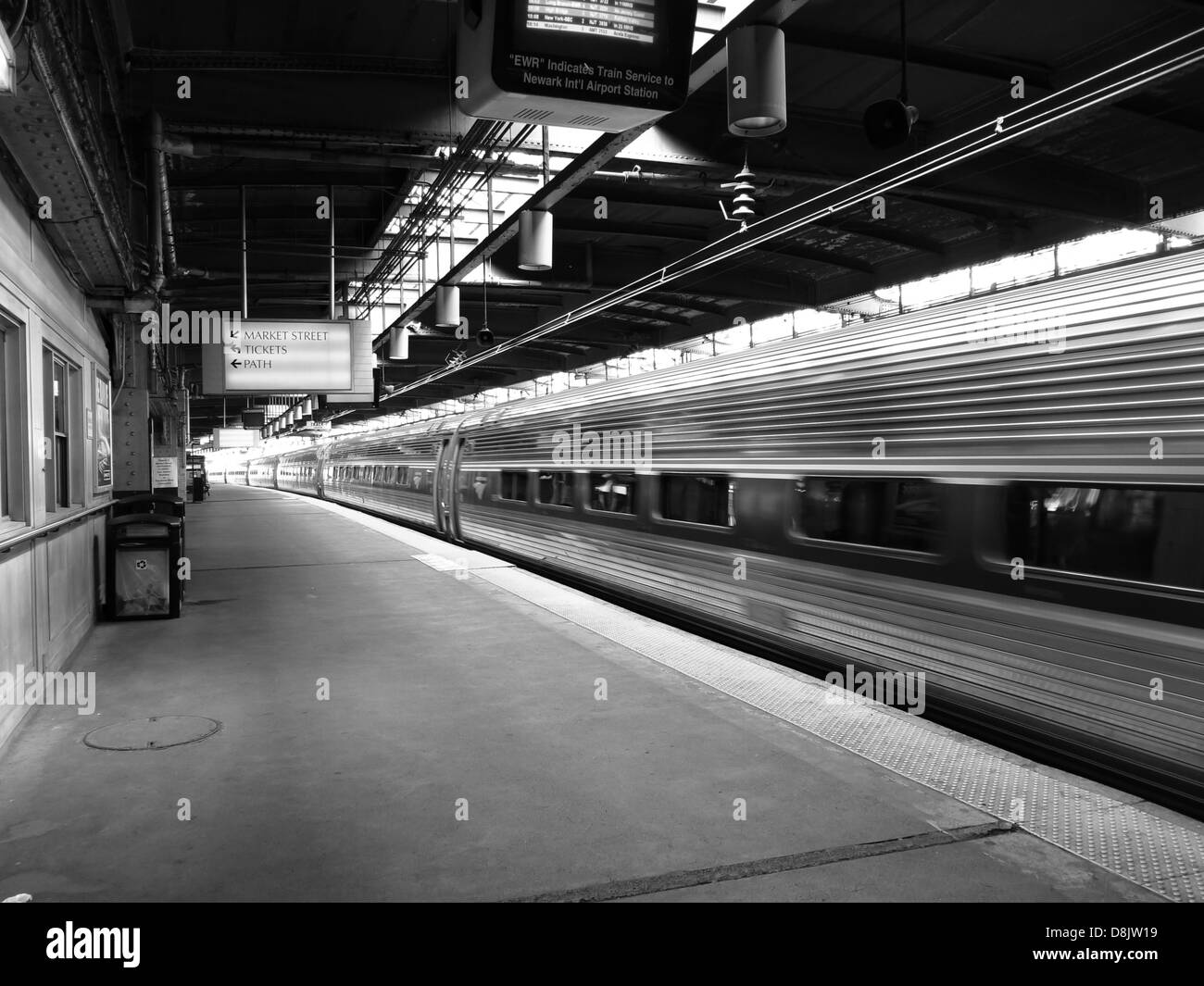 An Amtrak train arriving at an empty platform at Newark Penn Station ...