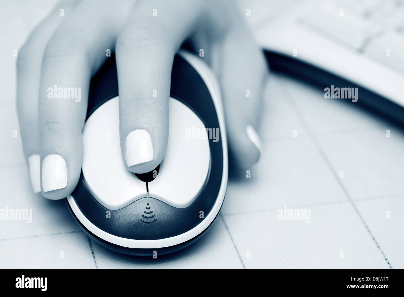 Female hand holding computer mouse Stock Photo - Alamy