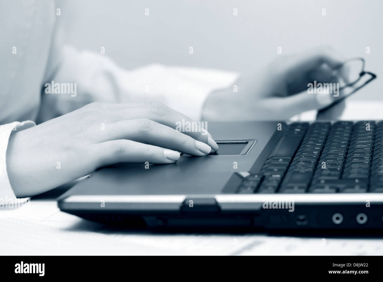 Female hands using laptop Stock Photo - Alamy