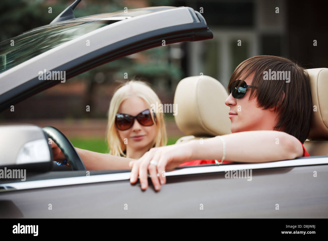 Young couple in a convertible car Stock Photo - Alamy