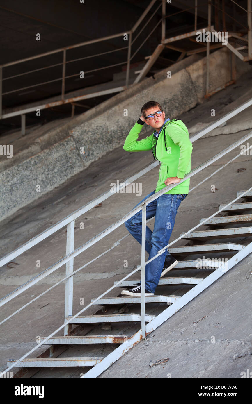 Young man standing on the steps Stock Photo - Alamy