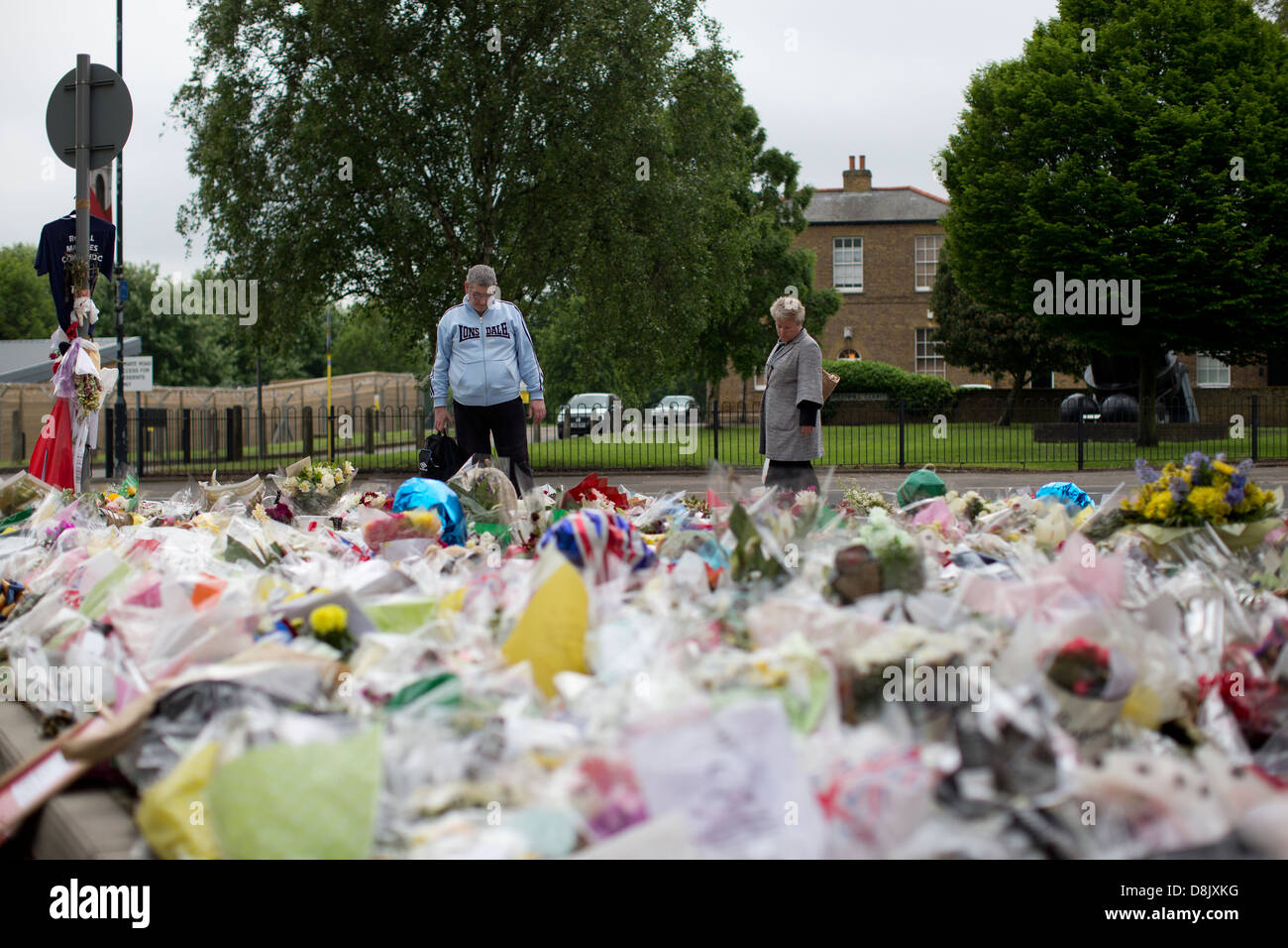 Flower are left at the scene where Drummer Lee Rigby was killed outside ...