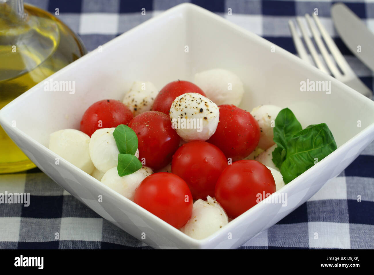 Mozzarella and cherry tomato salad Stock Photo - Alamy
